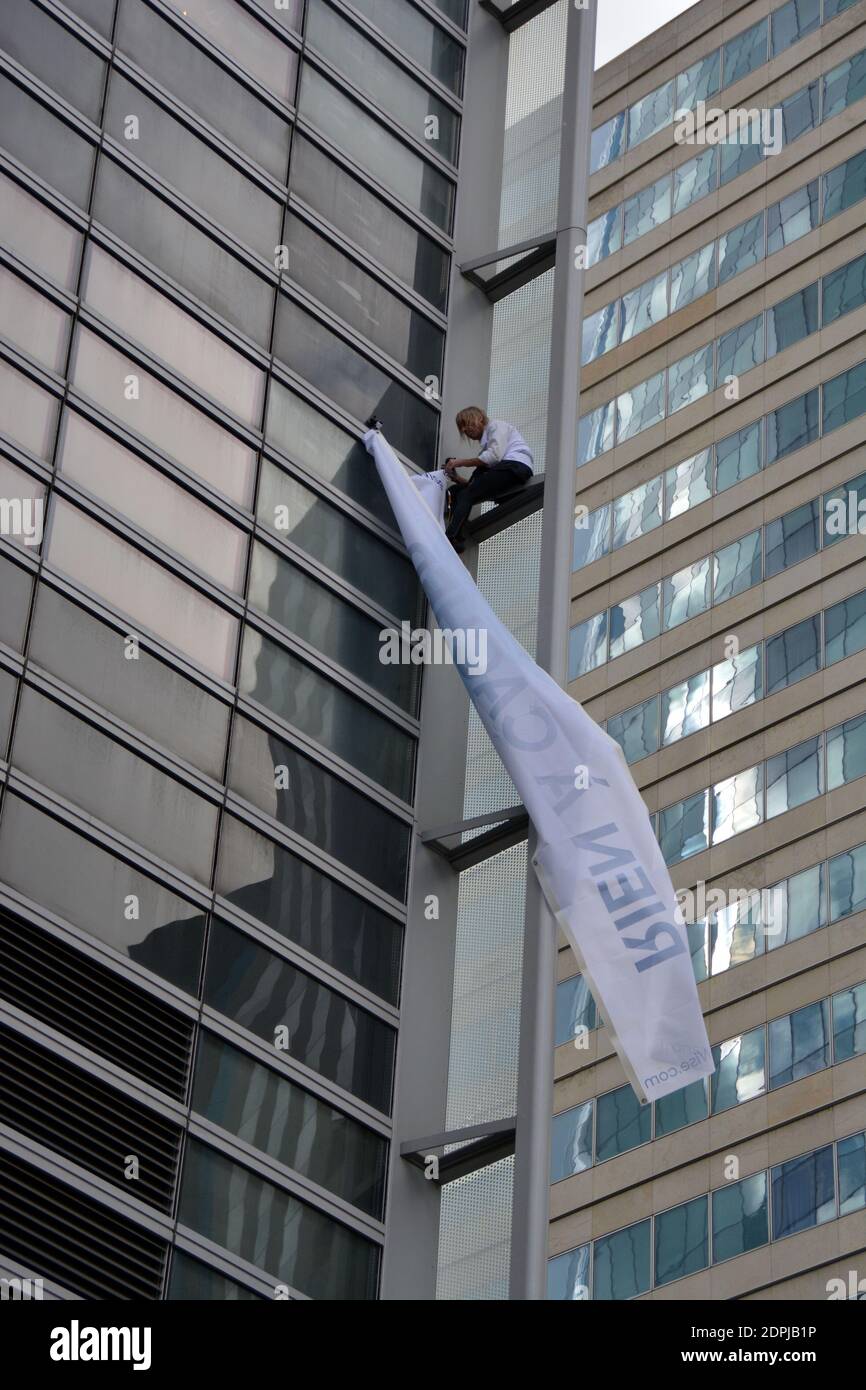French urban climber Alain Robert nicknamed 'Spiderman' climbing French ...