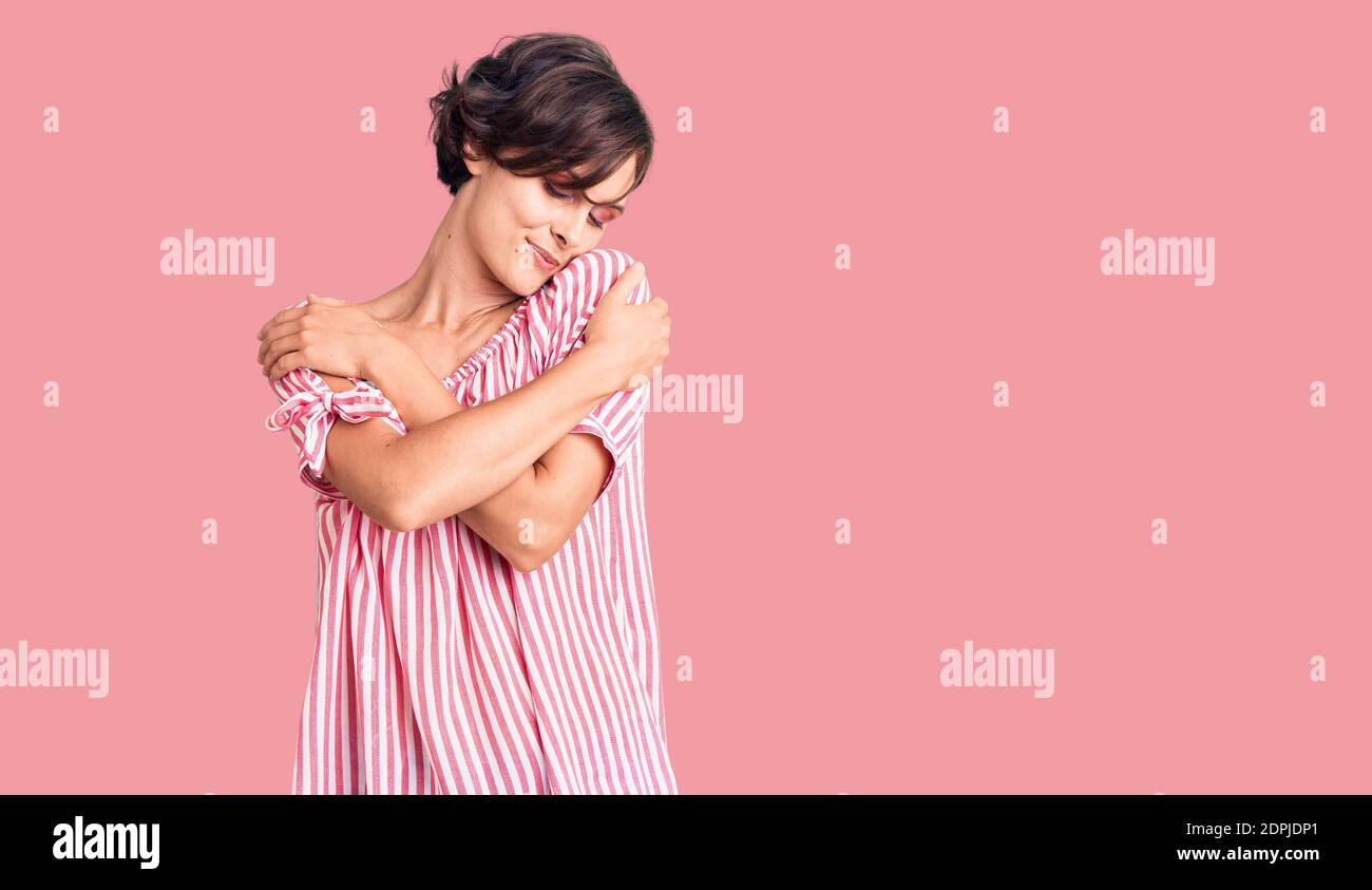 Beautiful young woman with short hair wearing casual summer clothes ...