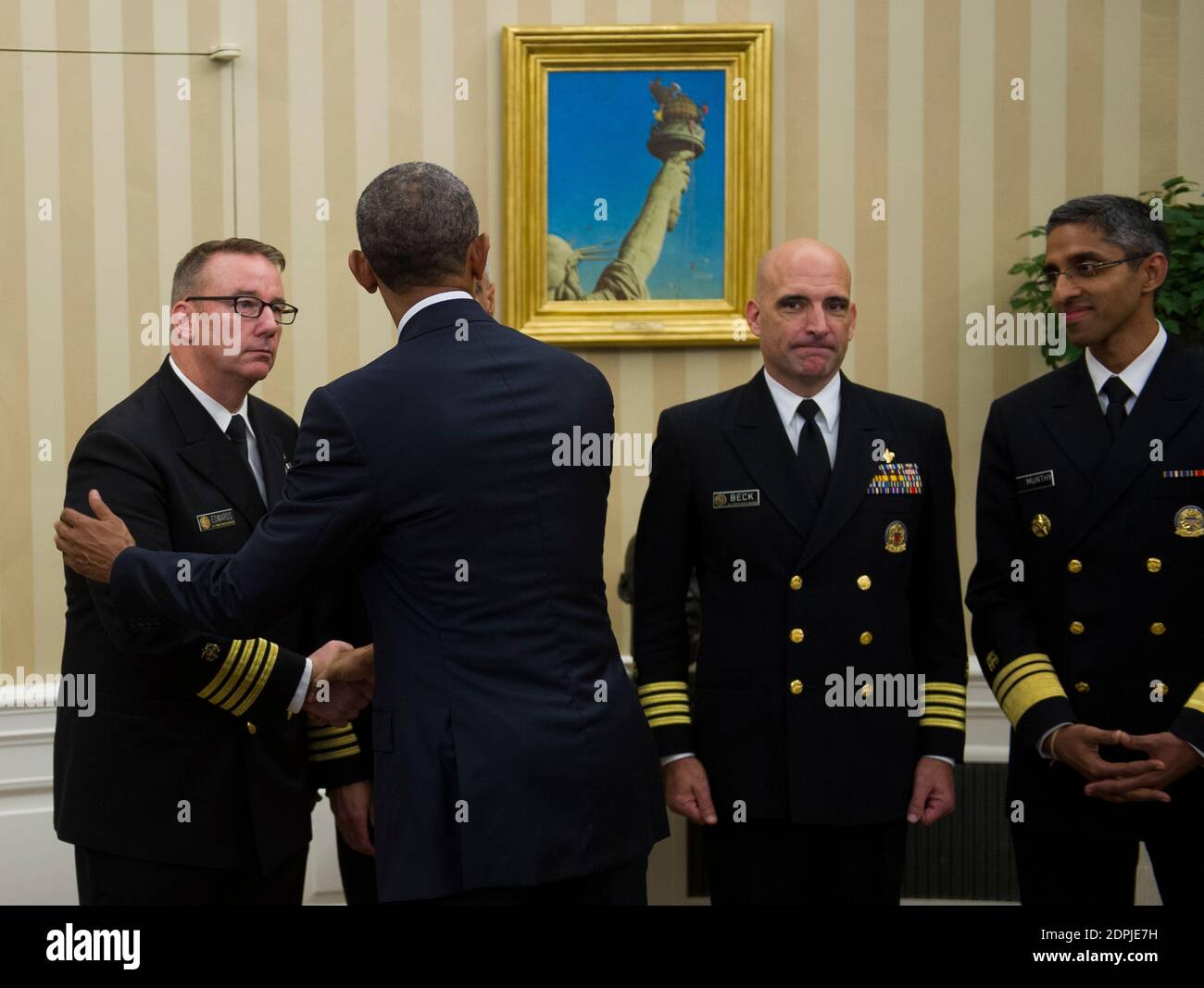 U.S. President Barack Obama shakes hands with Captain Calvin Edwards ...