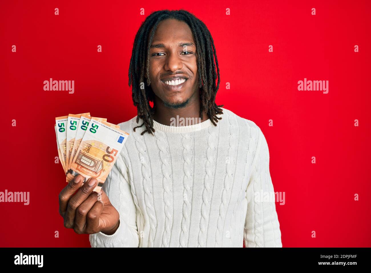 African american man with braids holding bunch of 50 euro banknotes ...