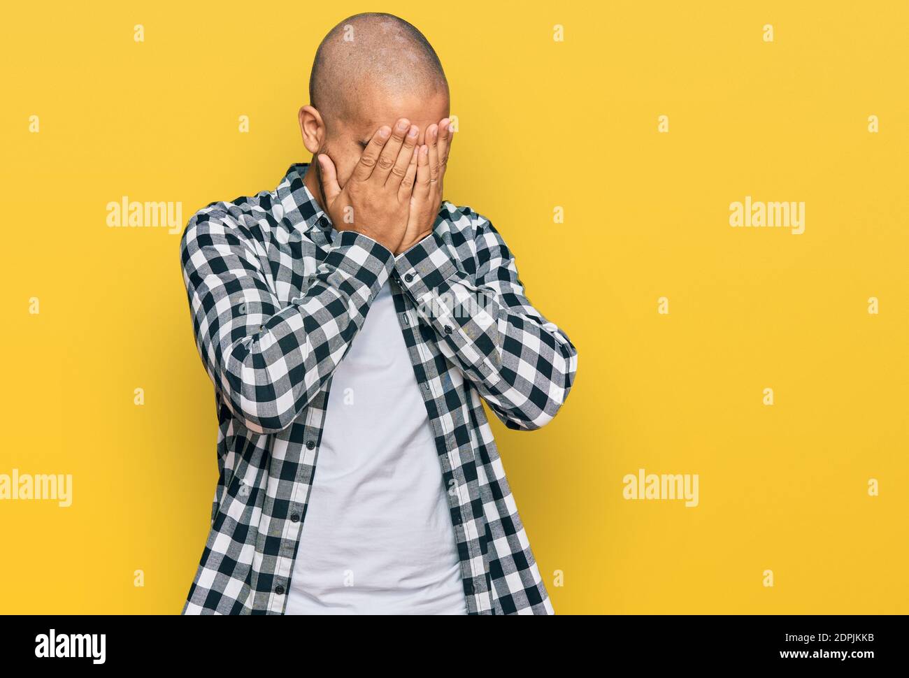Hispanic adult man wearing casual clothes with sad expression covering ...