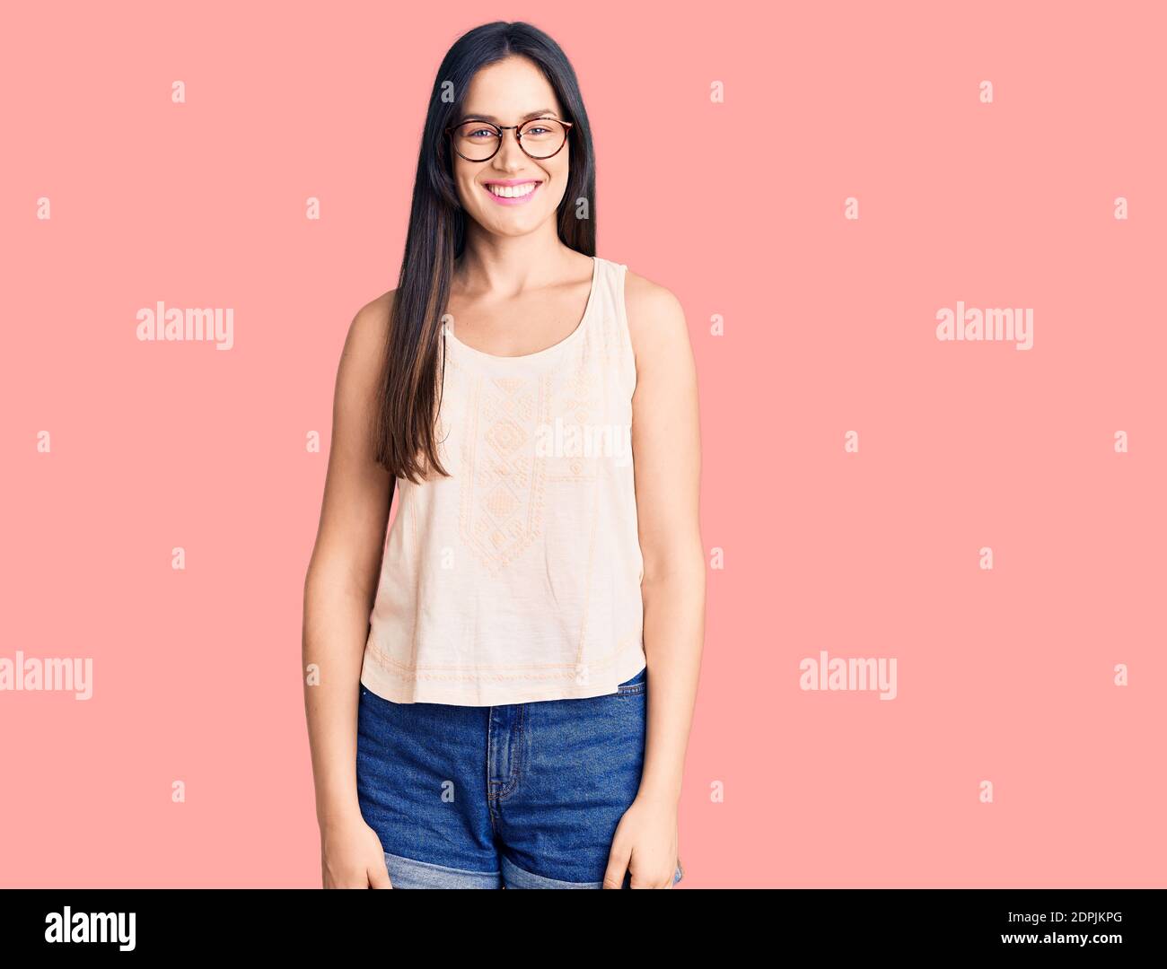Young beautiful caucasian woman wearing casual clothes and glasses with ...