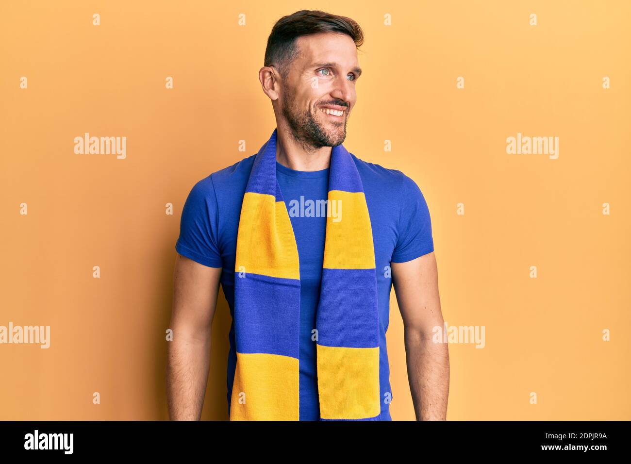 Handsome man with beard football hooligan cheering game looking to side ...