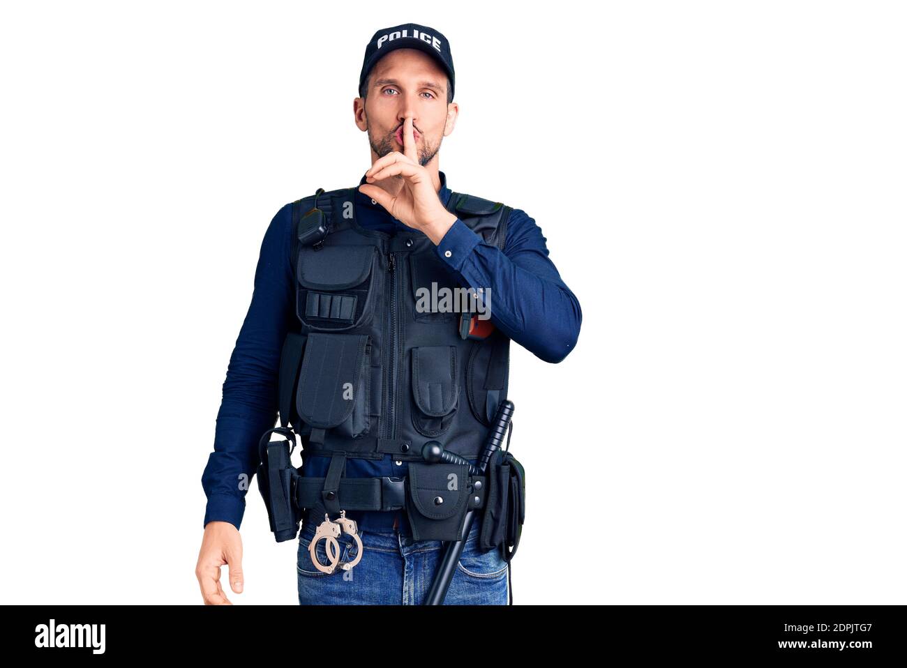 Young handsome man wearing police uniform asking to be quiet with ...