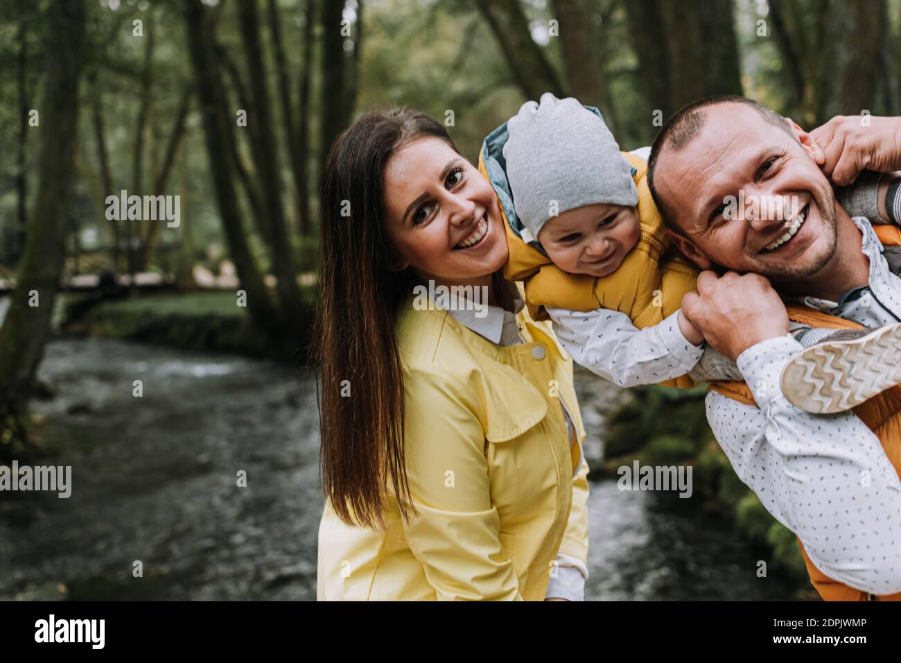 Family Time, Mom And Dad With Child Stock Photo - Alamy