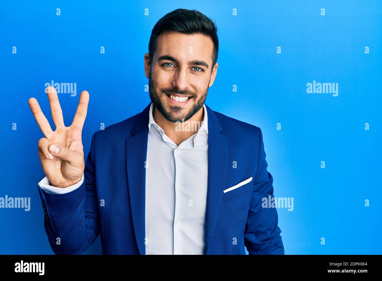 Young hispanic businessman wearing business jacket showing and pointing ...