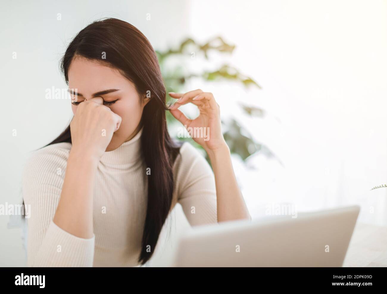 stressed young woman working with computer at home Stock Photo - Alamy