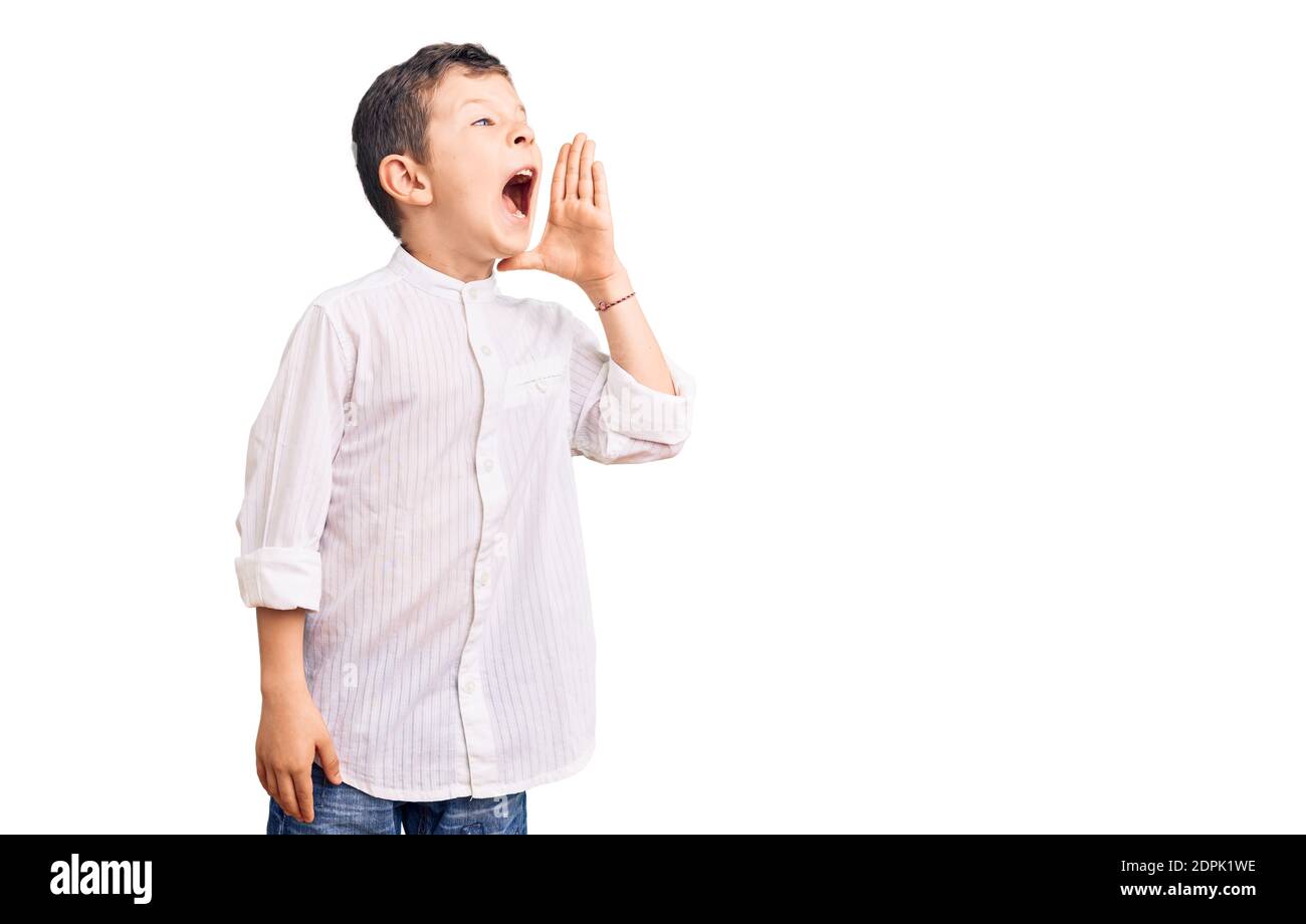 Cute blond kid wearing elegant shirt shouting and screaming loud to ...