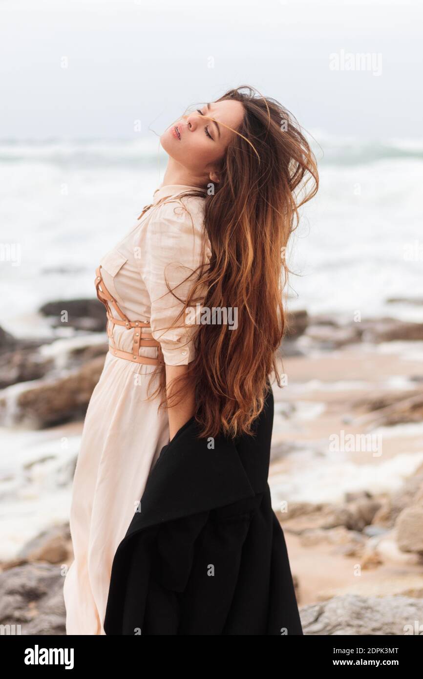 Woman windy day dress High Resolution Stock Photography and Images - Alamy