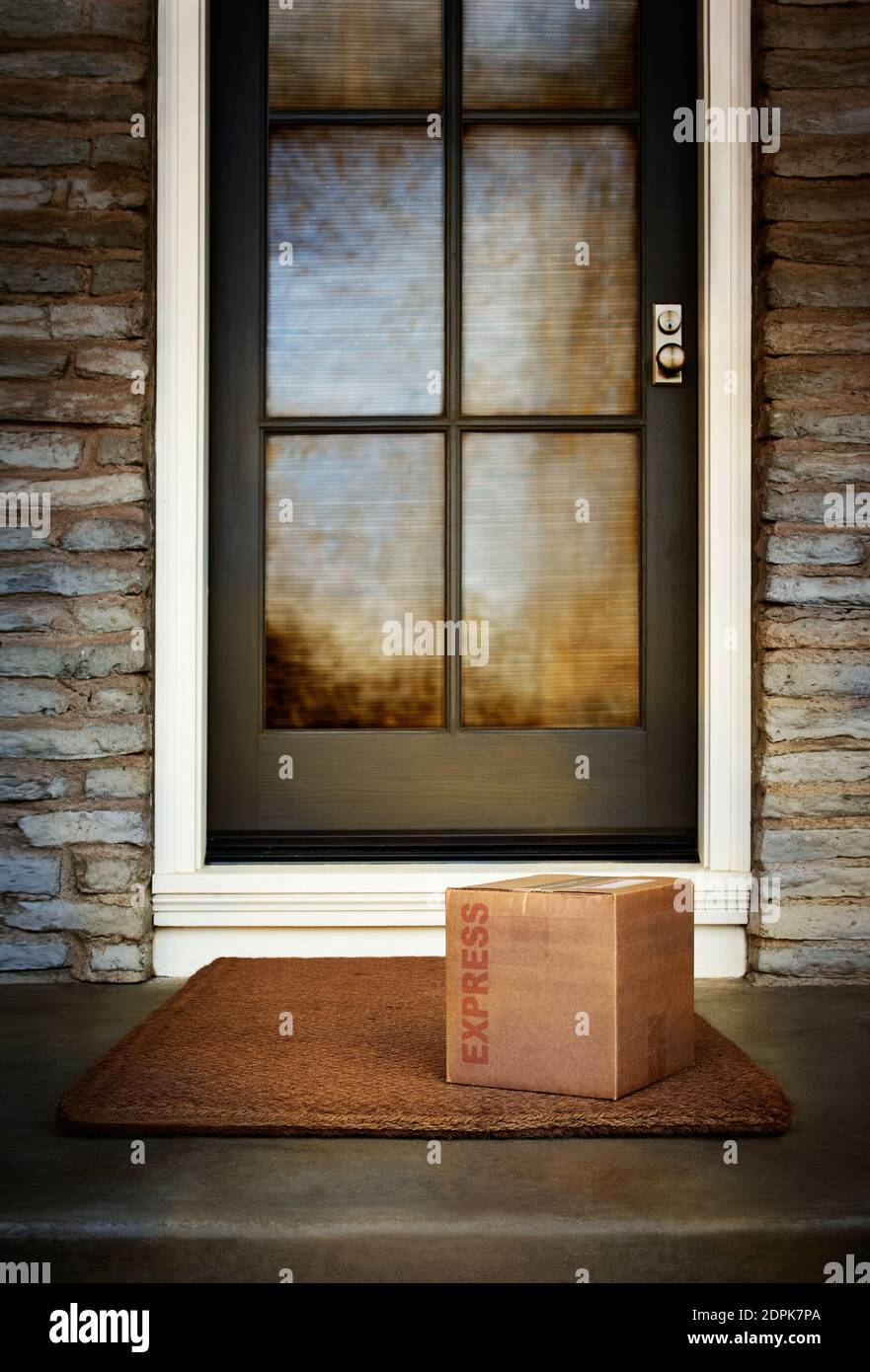 Online shopping express delivery box outside door. Copy space Stock ...