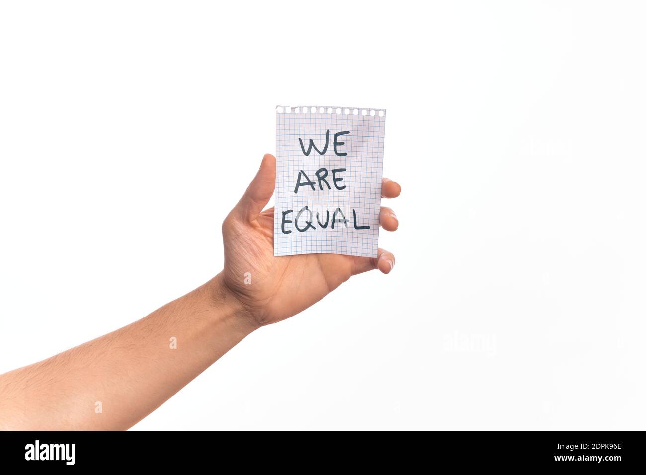 Cardboard banner WE ARE EQUAL, protesting for equal rights over ...