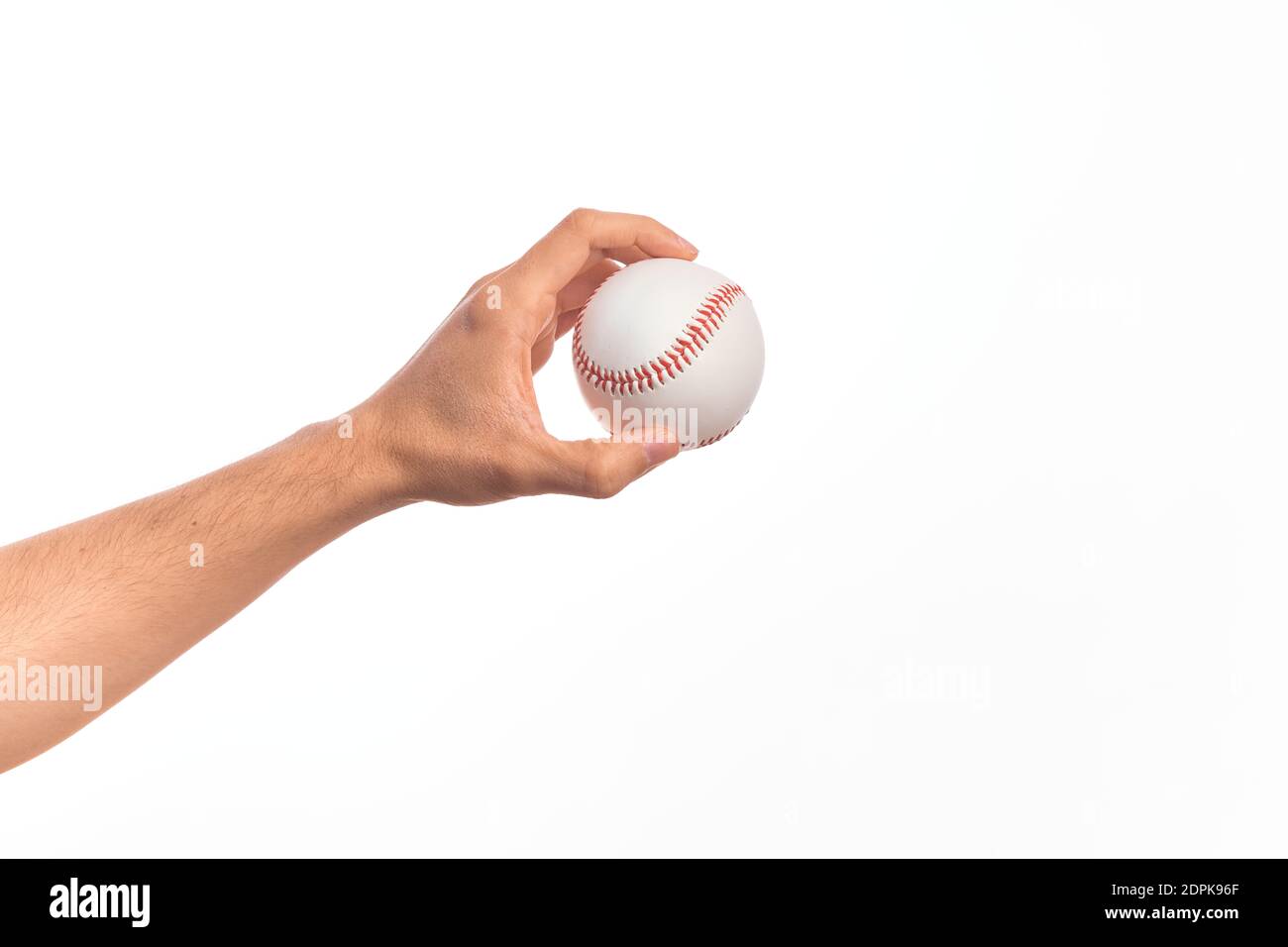 Hand of caucasian young man holding baseball ball over isolated white ...