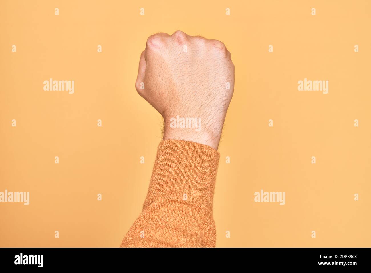Hand of caucasian young man showing fingers over isolated yellow ...