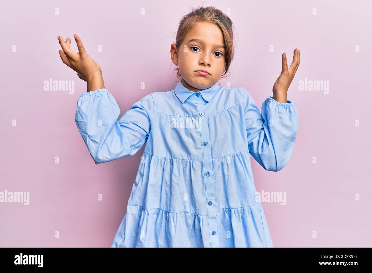 Little beautiful girl wearing casual clothes clueless and confused with ...