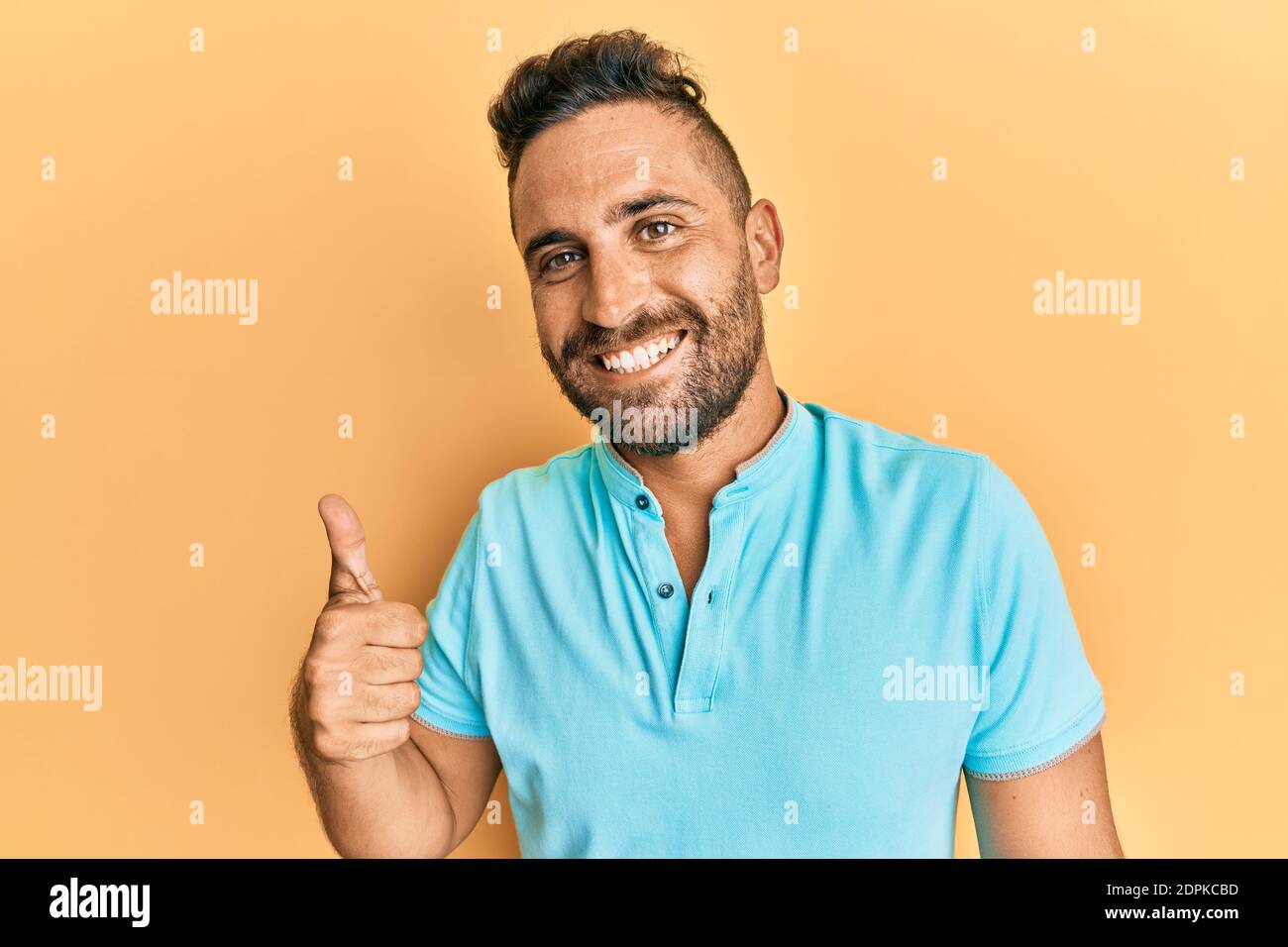 Handsome man with beard wearing casual clothes smiling happy and ...