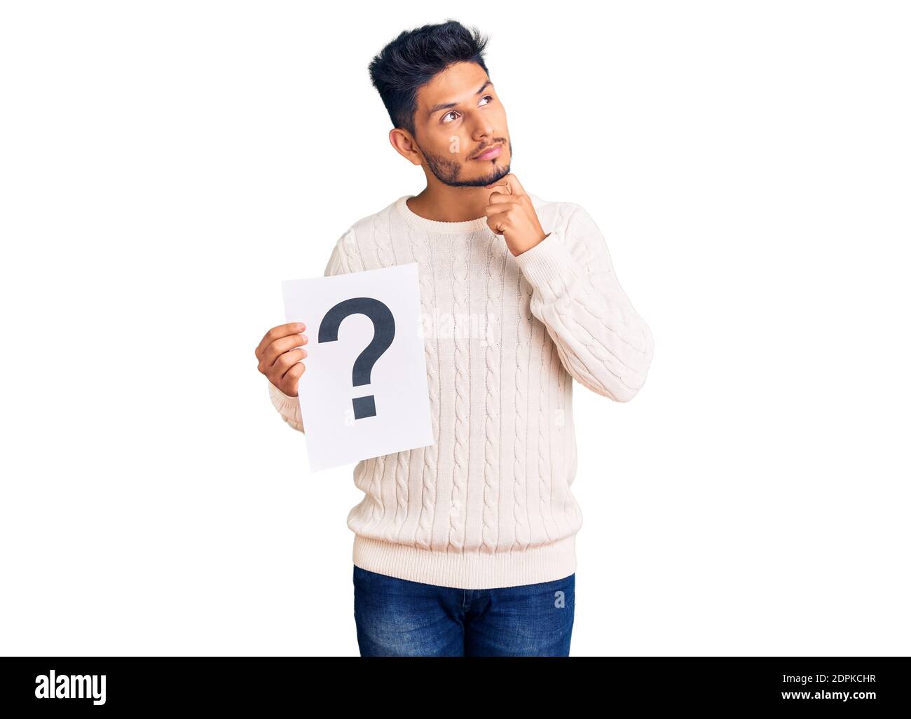 Handsome latin american young man holding question mark serious face ...