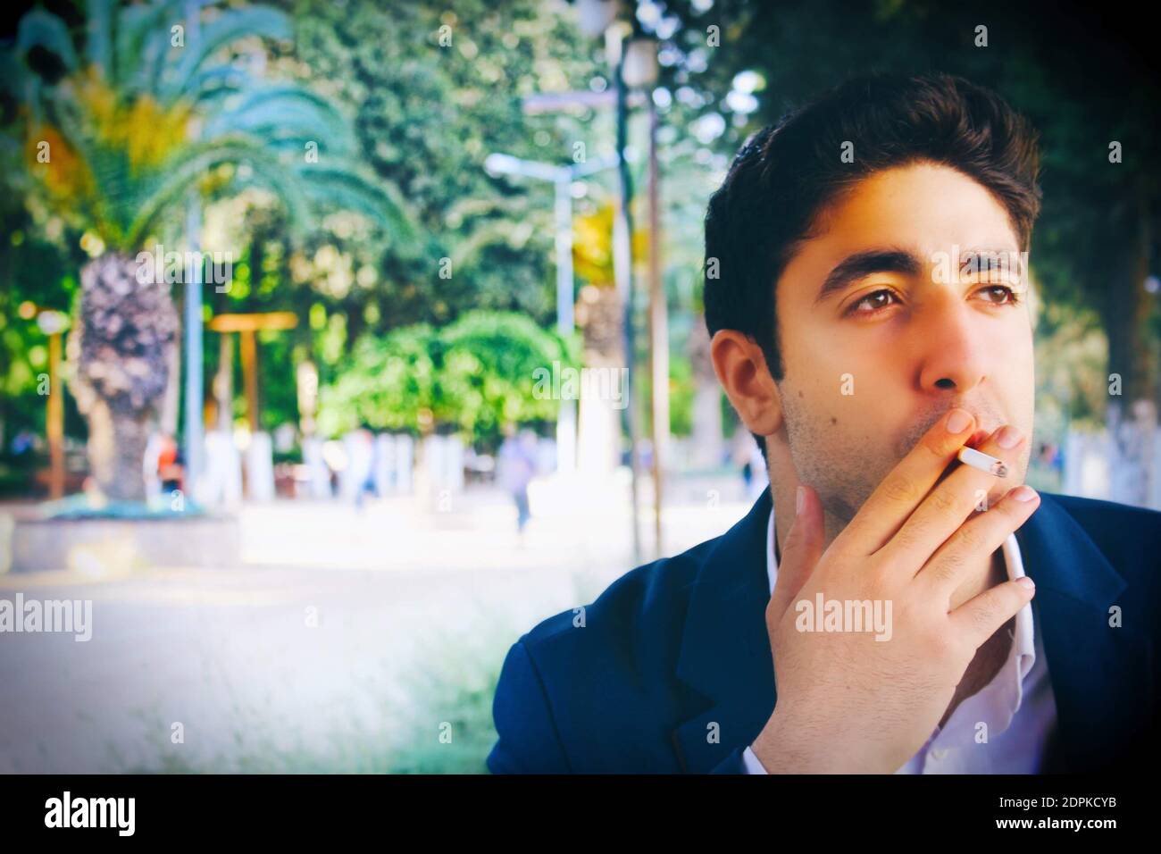 Person smoking in public park hi-res stock photography and images - Alamy