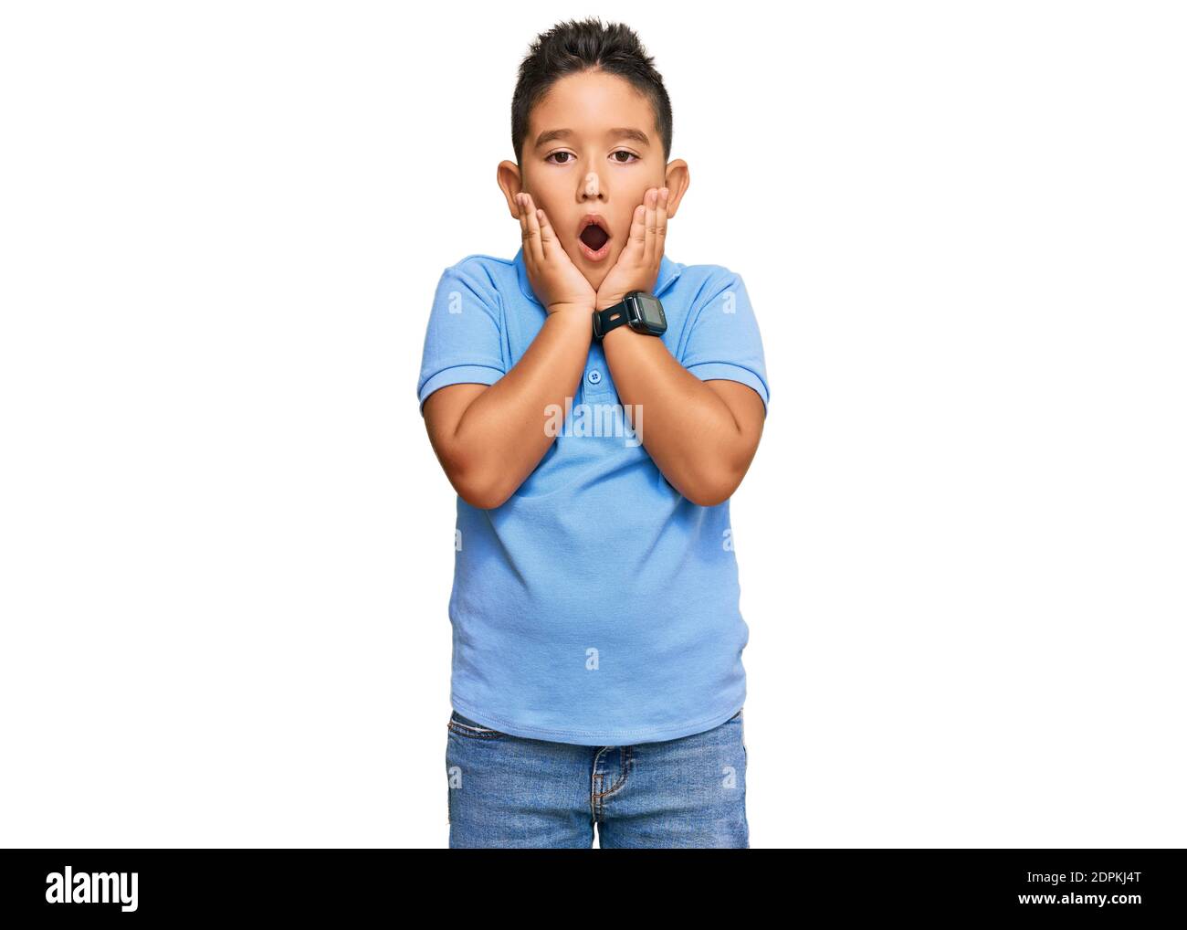 Little boy hispanic kid wearing casual clothes afraid and shocked ...