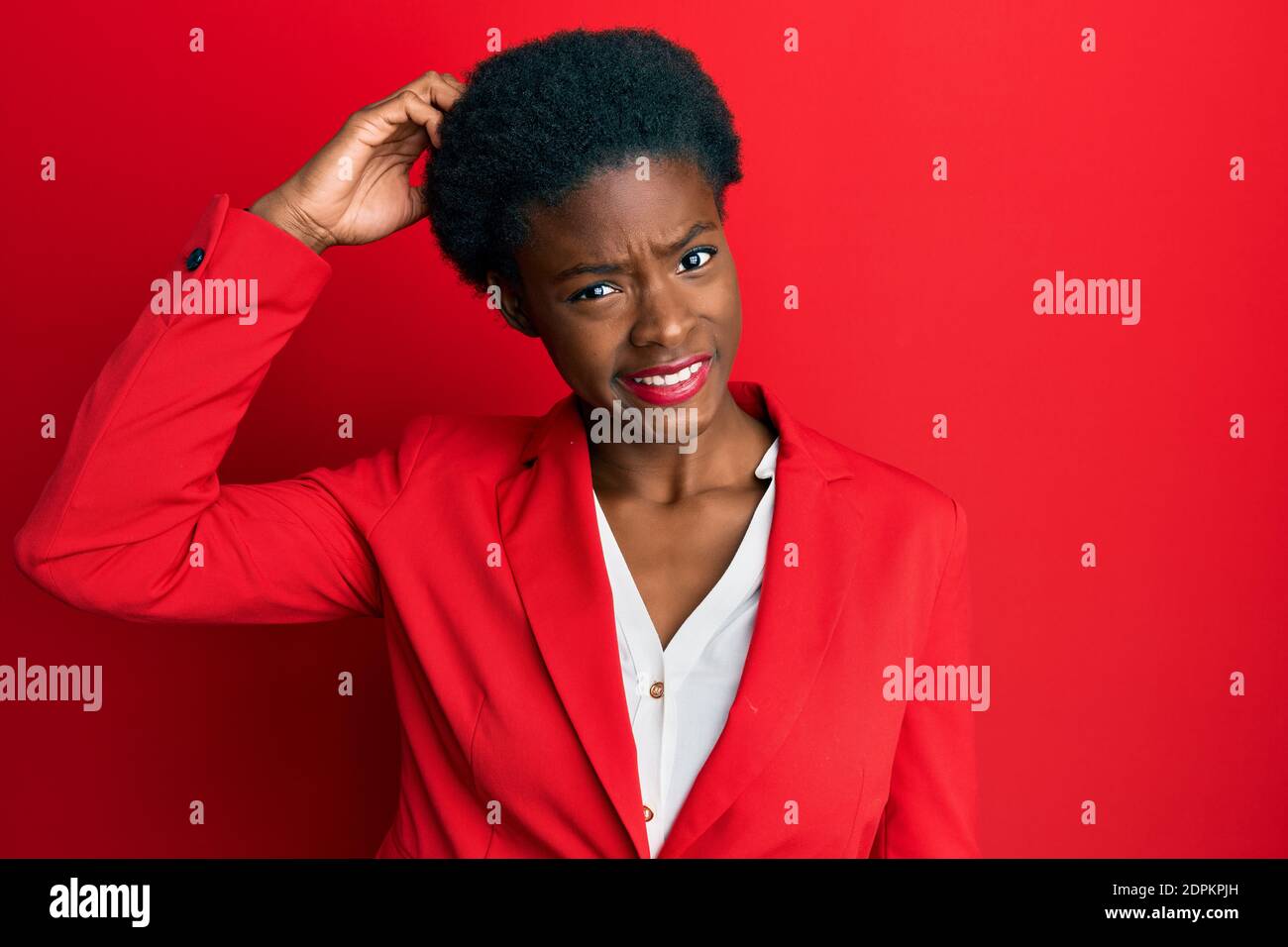 Young african american girl wearing business clothes confuse and wonder ...