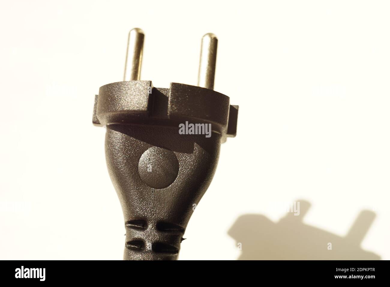 Black power plug on white background with shadow Stock Photo - Alamy