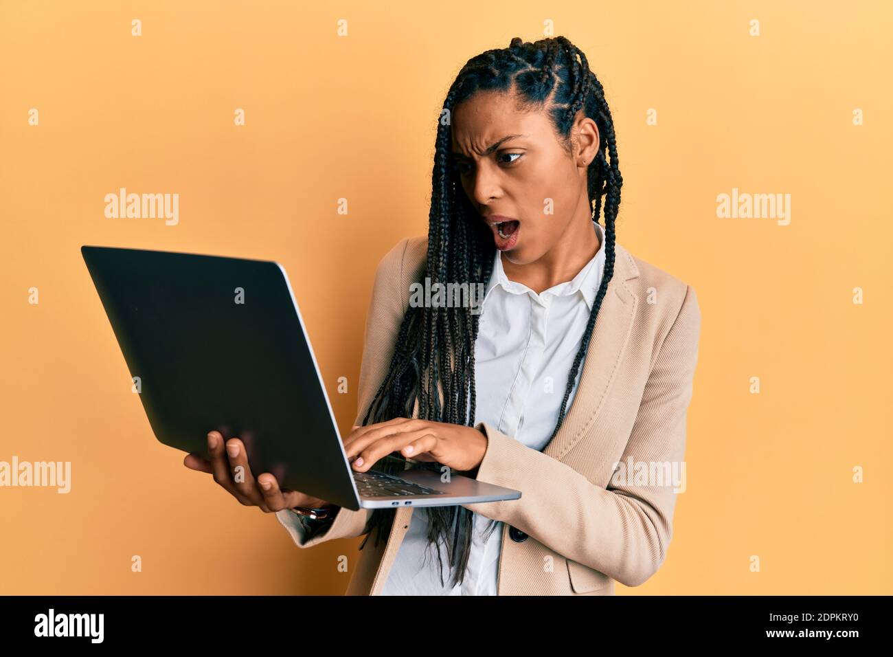 African american woman working using computer laptop clueless and ...