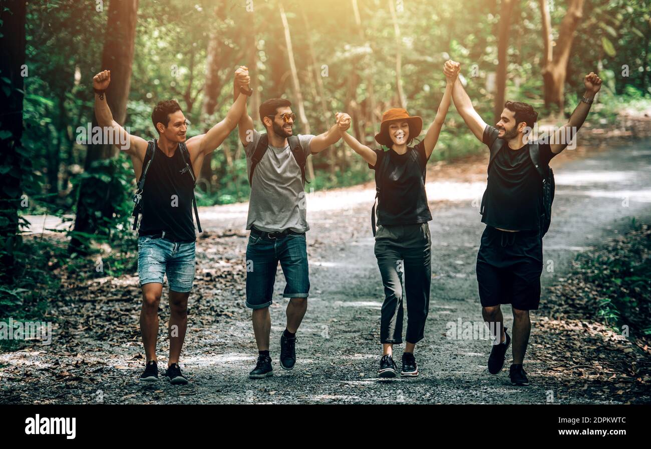 Four friends holding hands arms hi-res stock photography and images - Alamy