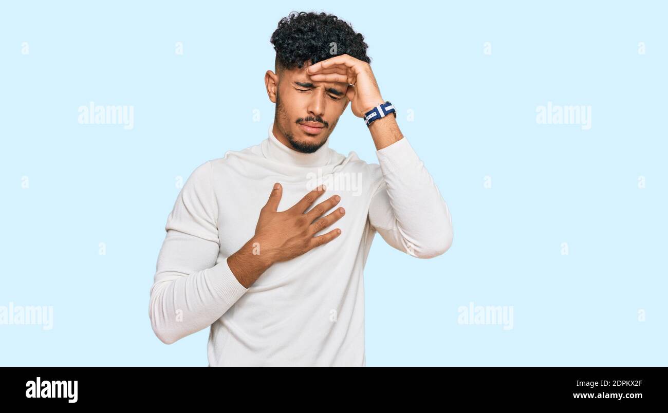 Young arab man wearing casual winter sweater touching forehead for ...