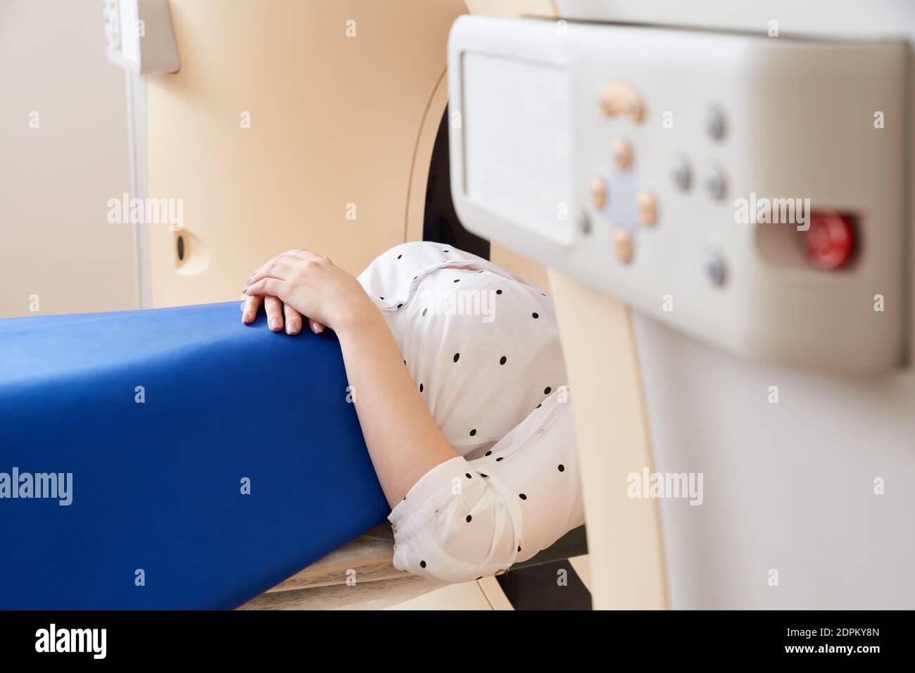 Woman going through a Computerized Axial Tomography CAT scanner. Scan ...