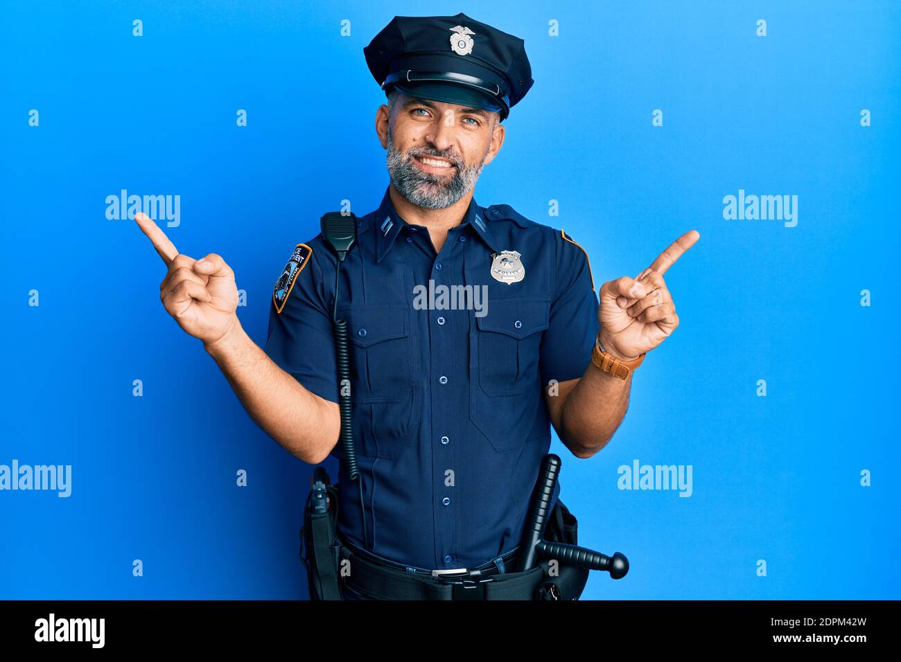 Middle age handsome man wearing police uniform smiling confident ...