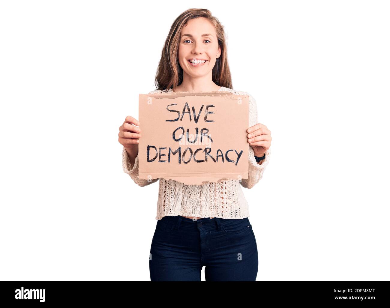 Young beautiful blonde woman holding save our democracy banner looking ...