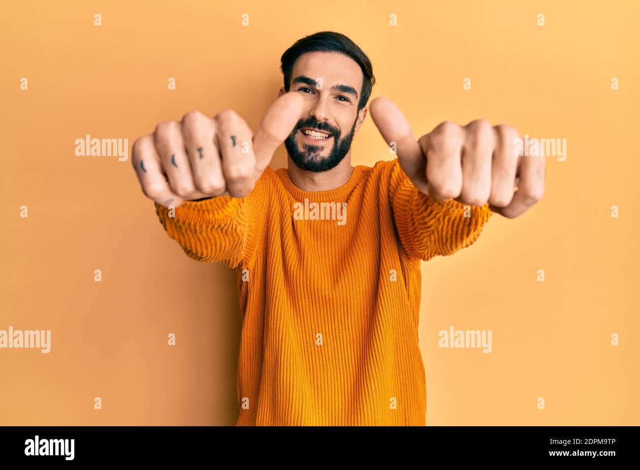 Young hispanic man wearing casual clothes approving doing positive ...