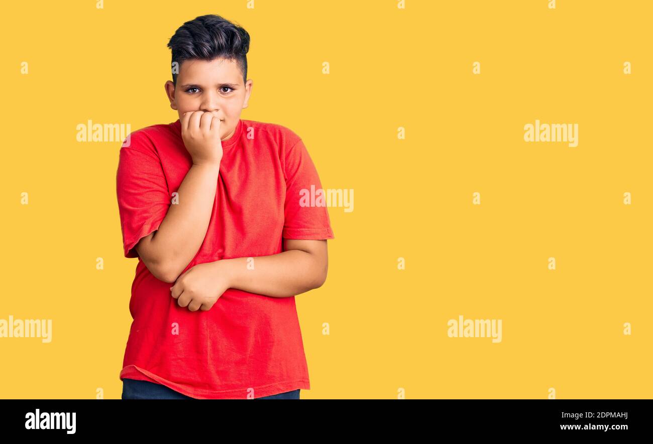 Little boy kid wearing casual clothes looking stressed and nervous with ...