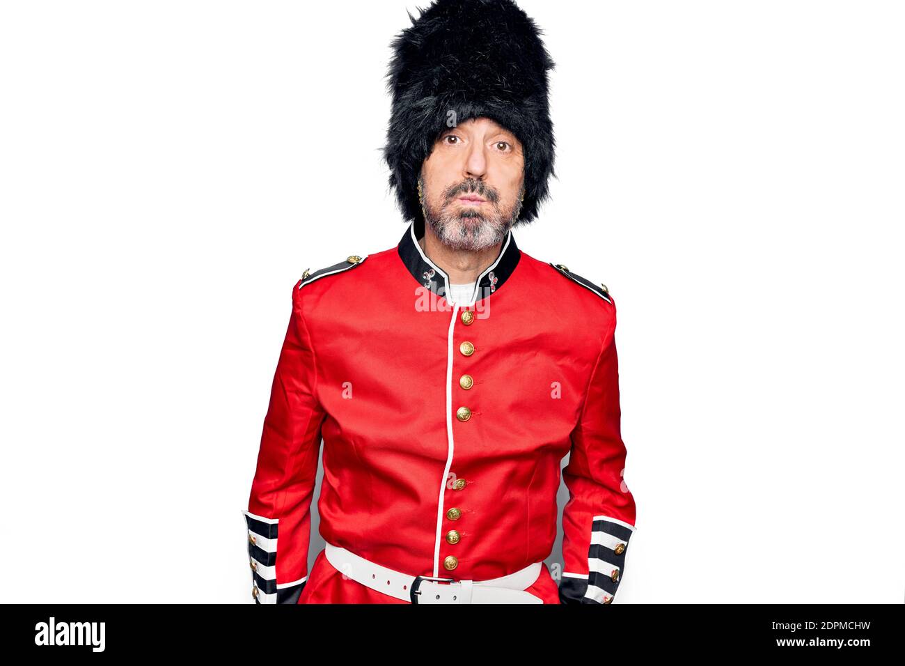 Middle age handsome wales guard man wearing traditional uniform over ...