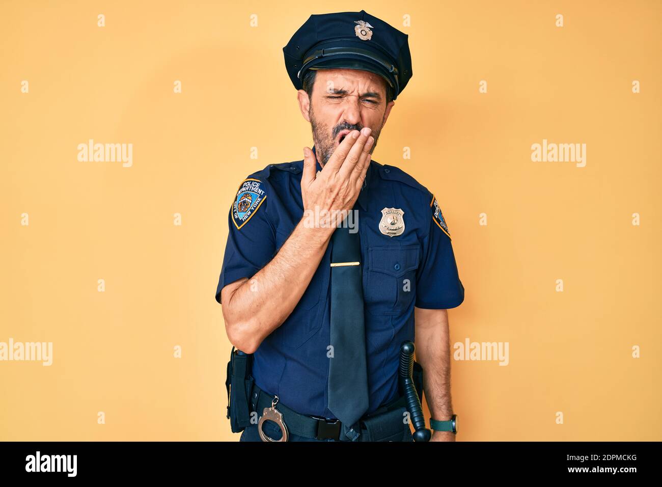 Middle age hispanic man wearing police uniform bored yawning tired ...