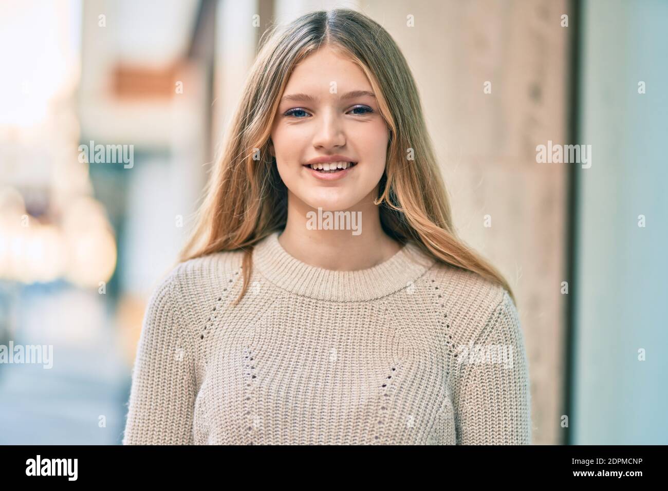 Beautiful caucasian teenager smiling happy standing at the city Stock ...
