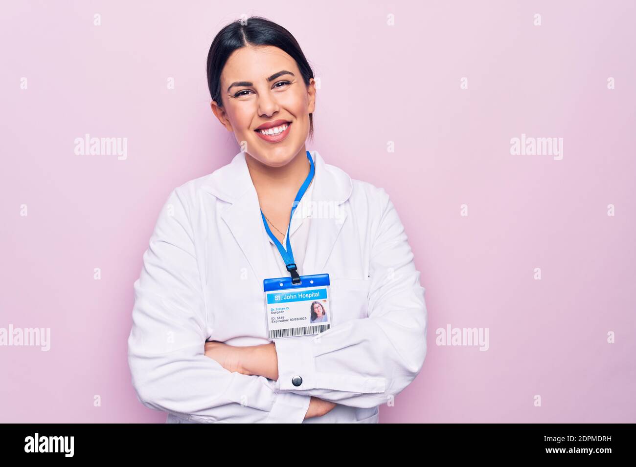 Young beautiful doctor woman wearing stethoscope and id card over ...