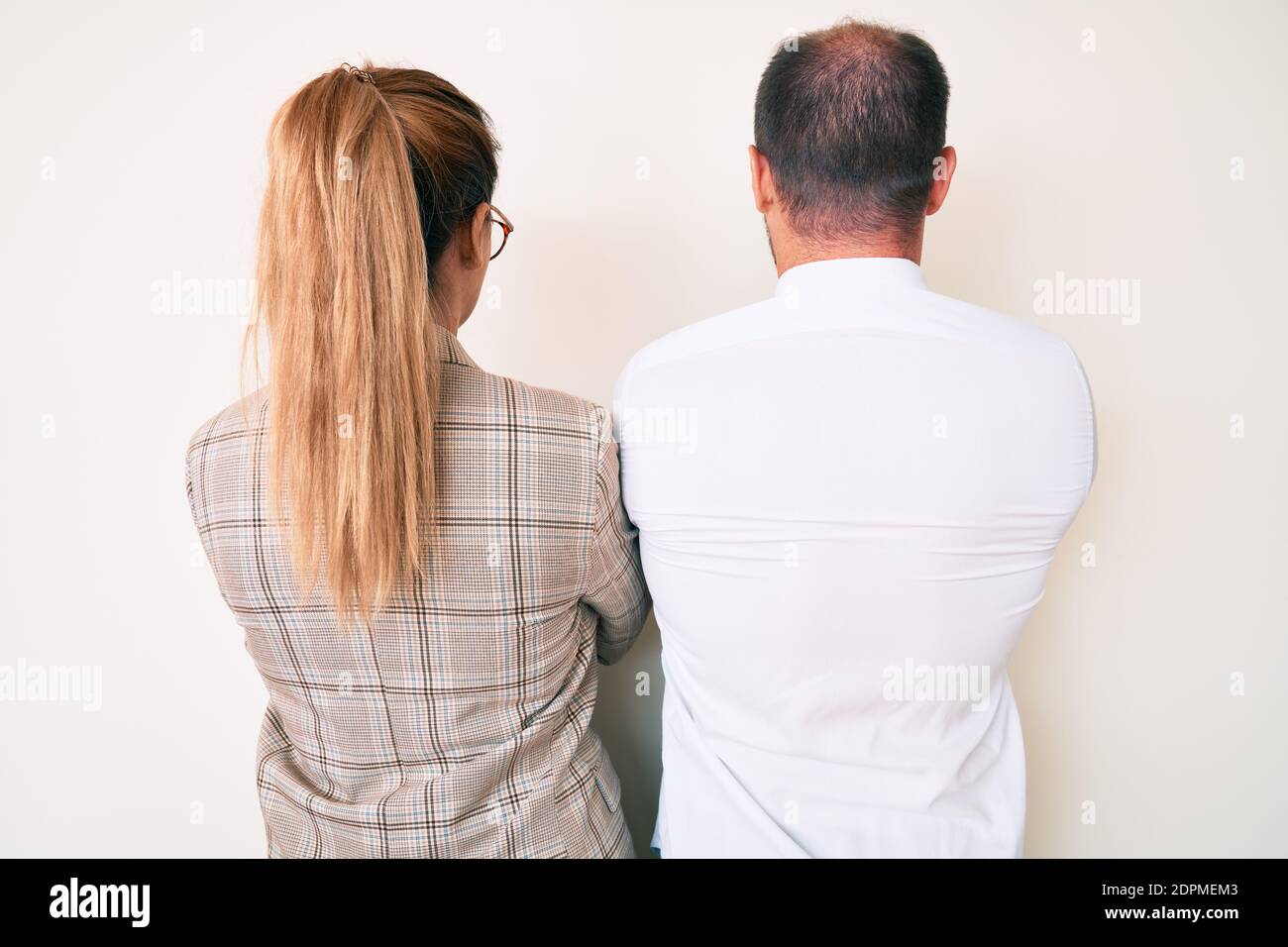 Beautiful couple standing backwards hi-res stock photography and images ...