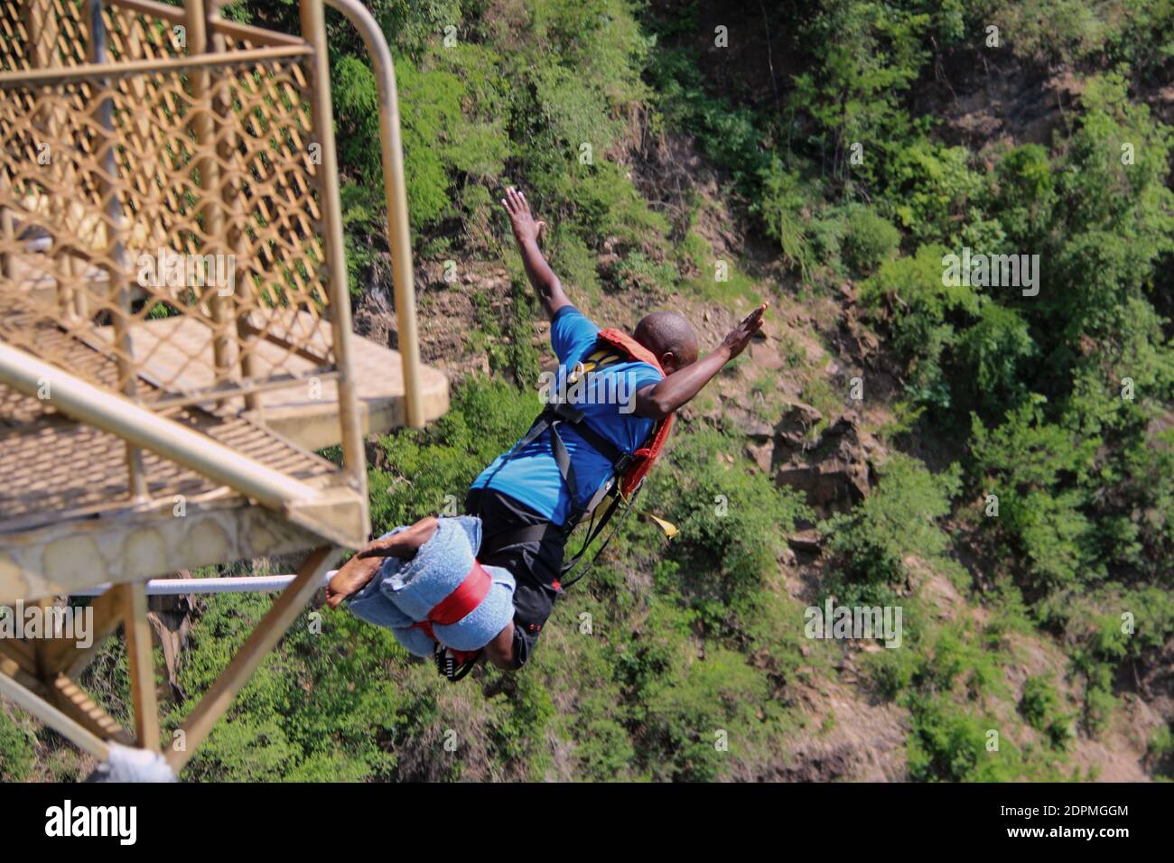 Man jumping over river hi-res stock photography and images - Alamy