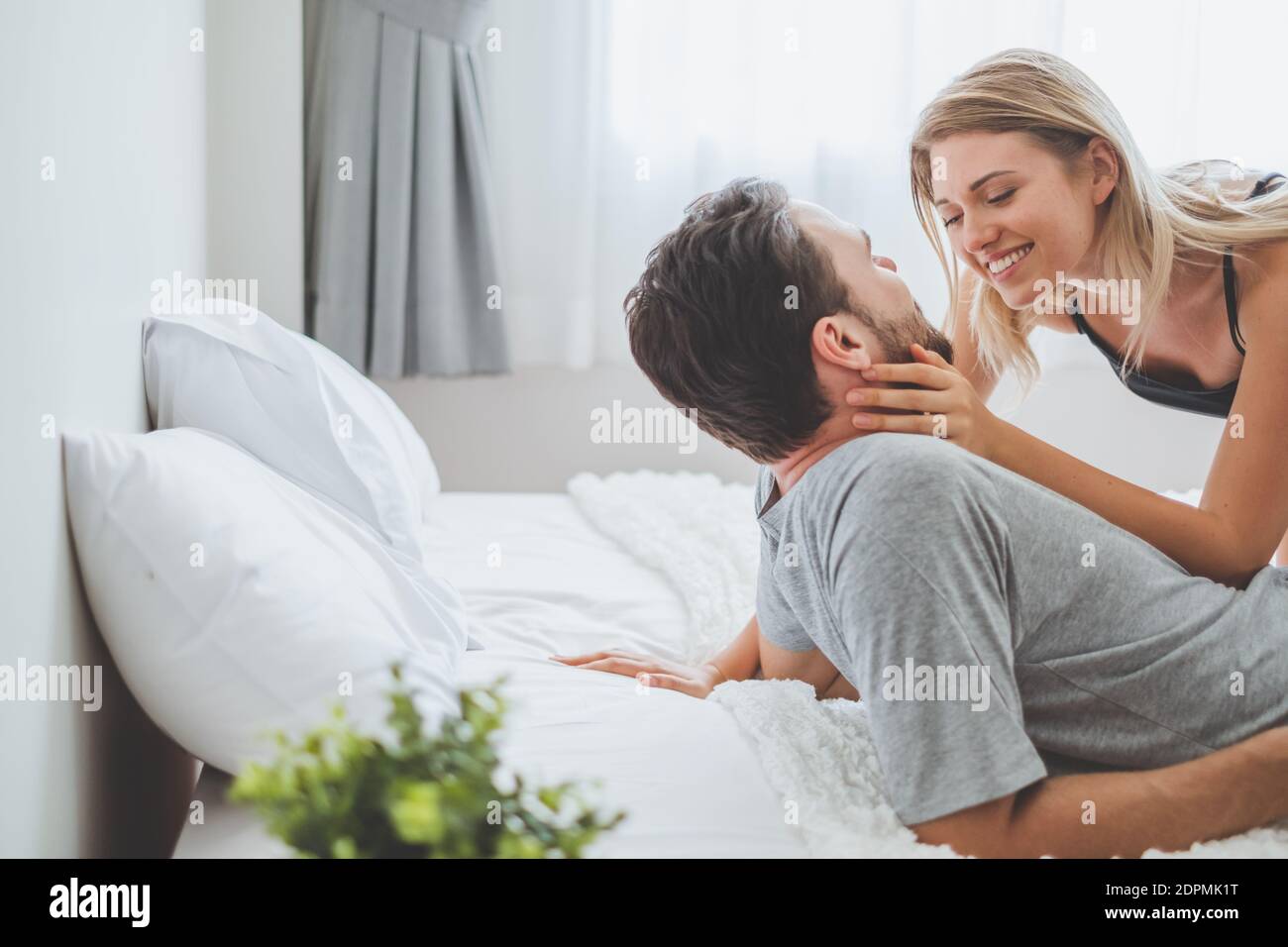 Passionate couple kissing bedroom hi-res stock photography and images ...