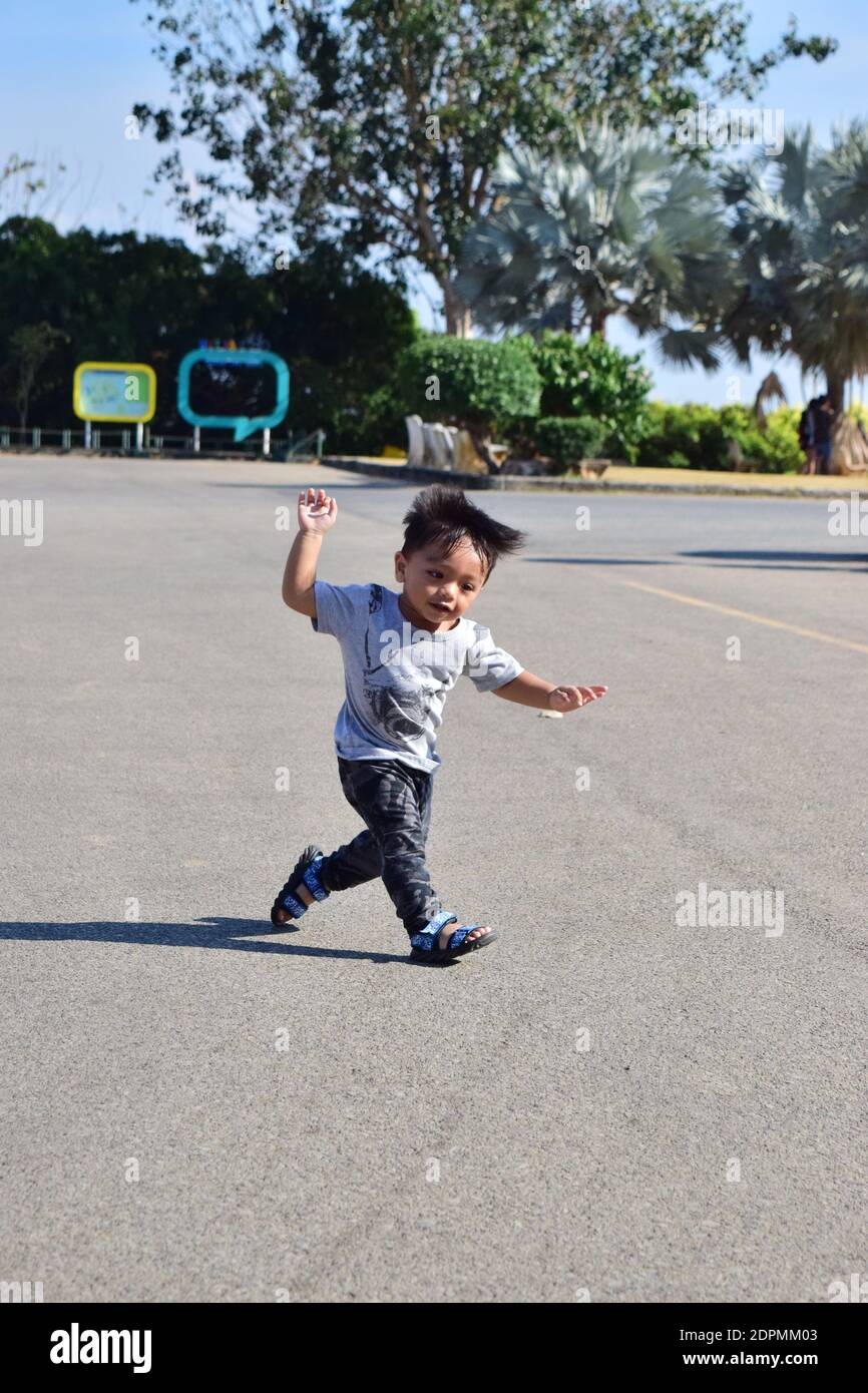 Boys running in the road hi-res stock photography and images - Alamy