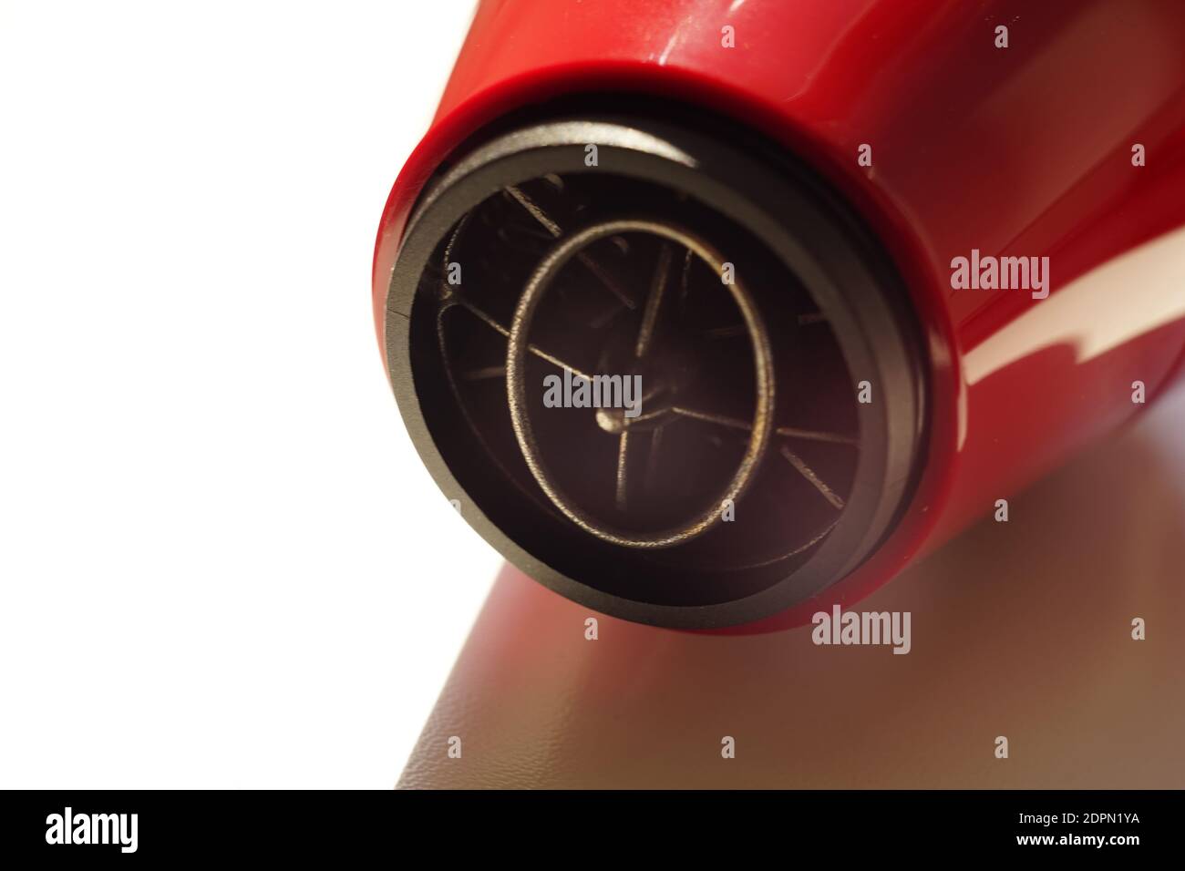 new red hair dryer, front view on a plastic mesh Stock Photo - Alamy