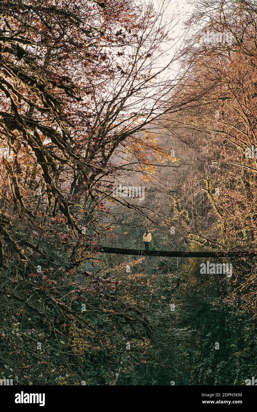 Young woman crossing bridge hi-res stock photography and images - Alamy