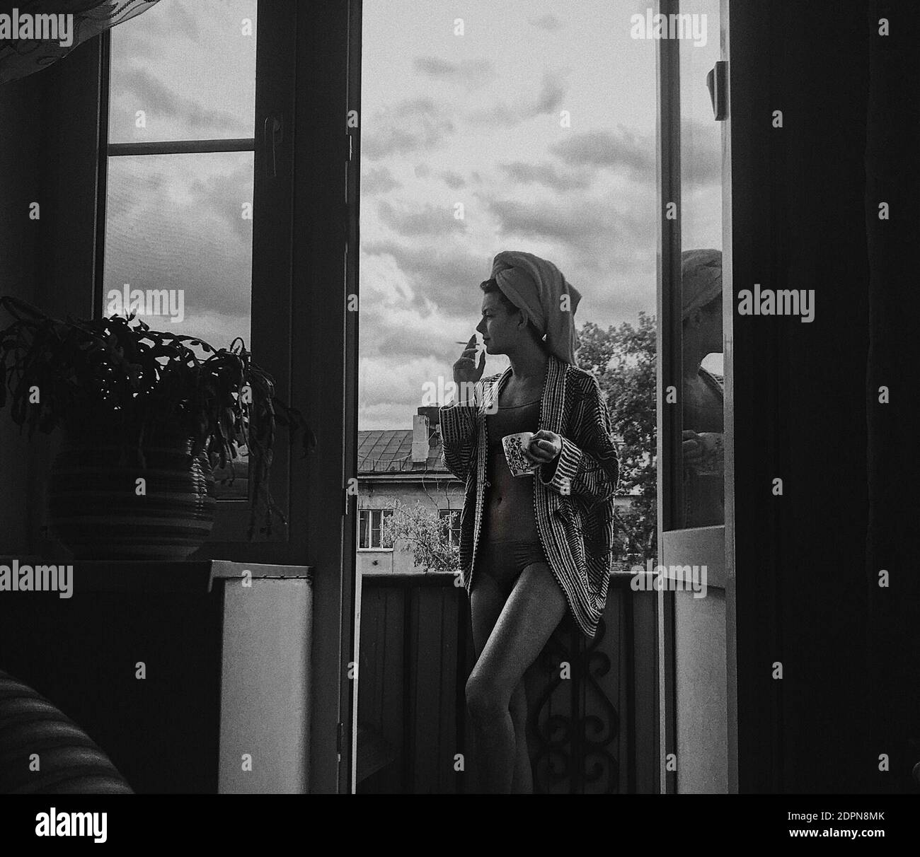 Woman Smoking Balcony High Resolution Stock Photography and Images - Alamy
