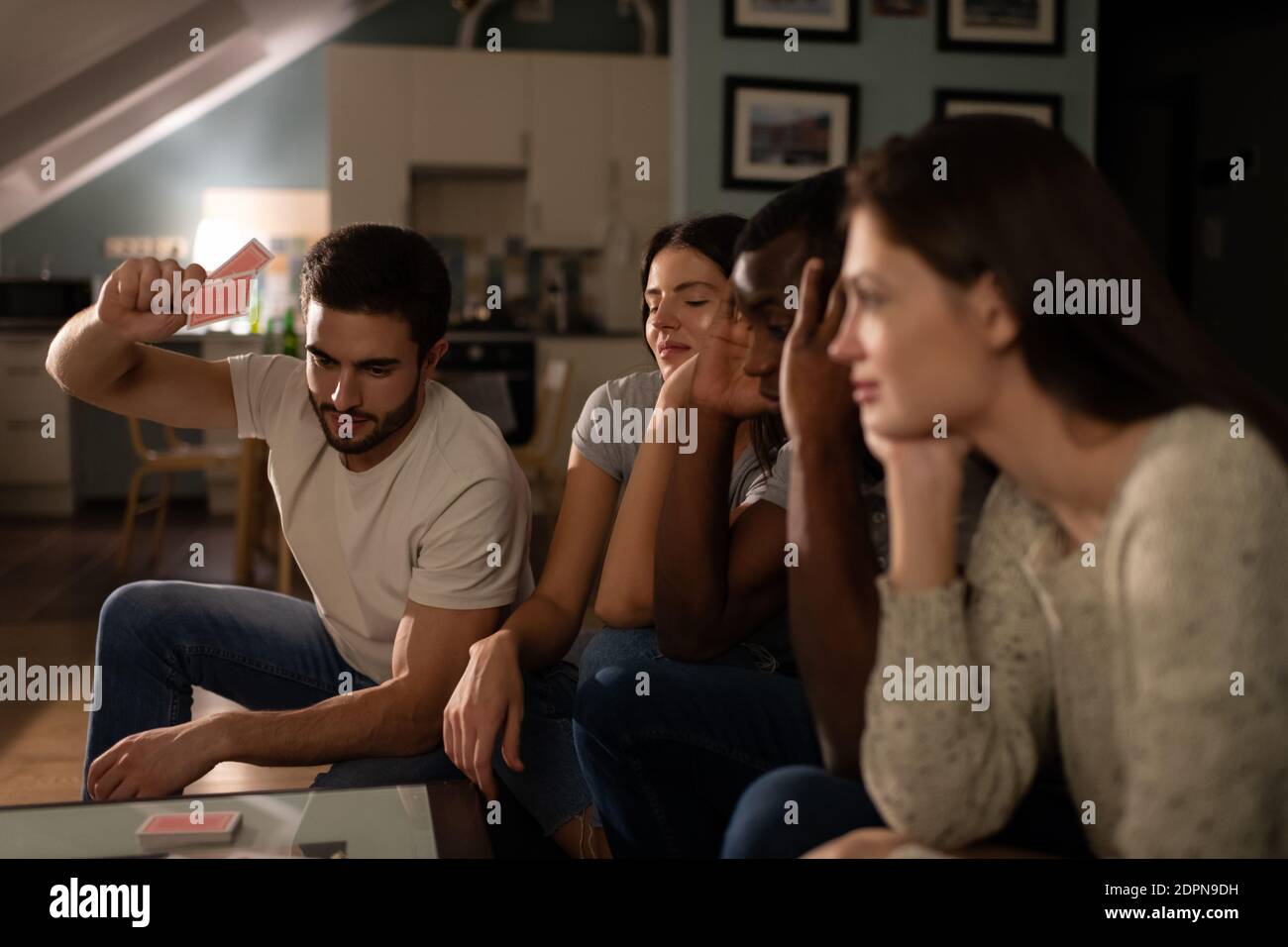 Positive bearded guy throwing cards on table while beating shocked ...