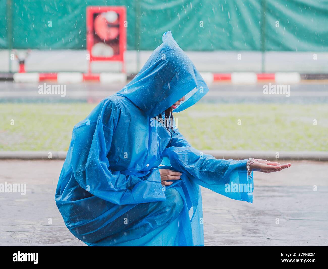 Side view woman wearing raincoat hi-res stock photography and images ...