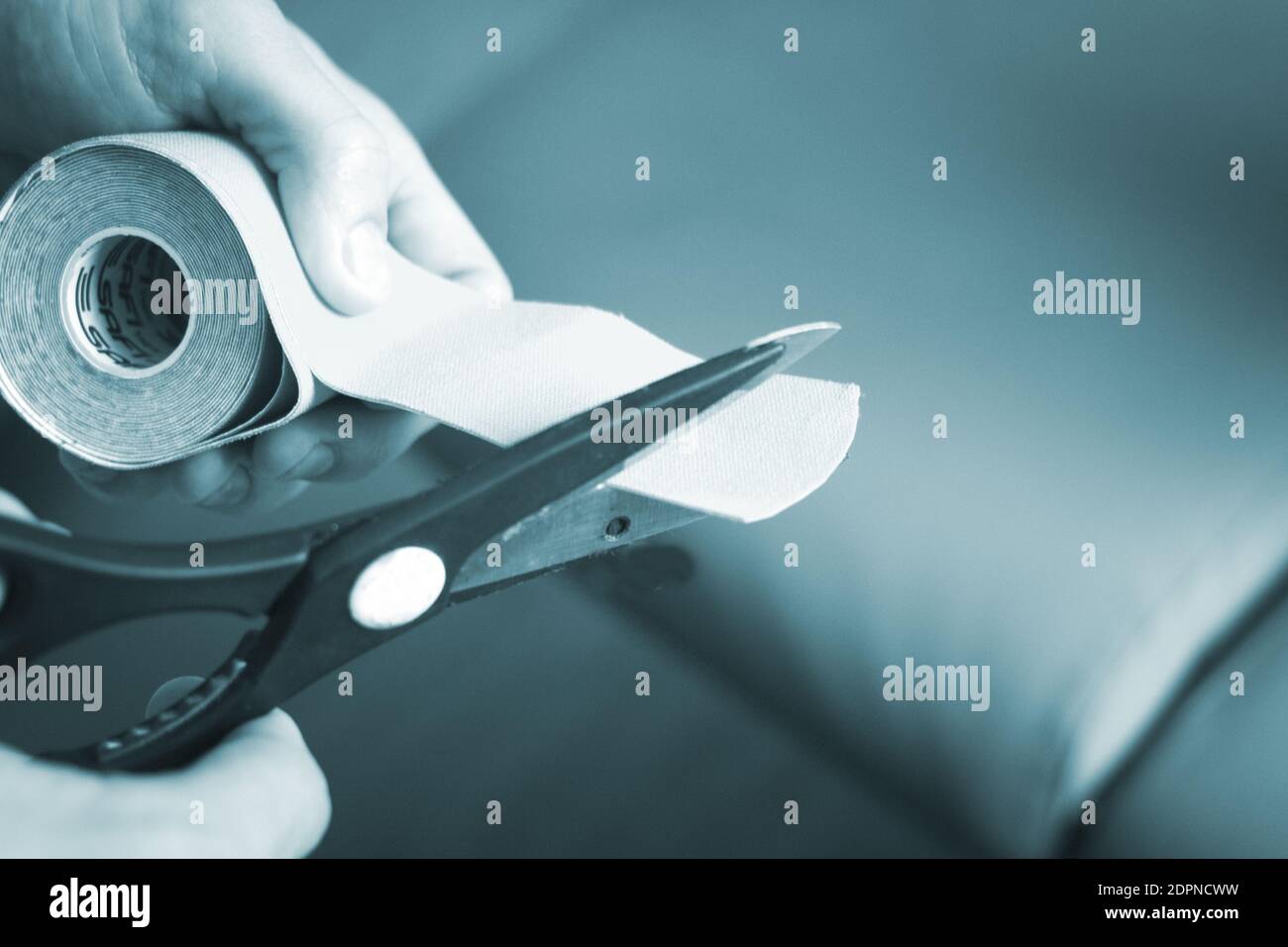 Hand cutting bandage hi-res stock photography and images - Alamy