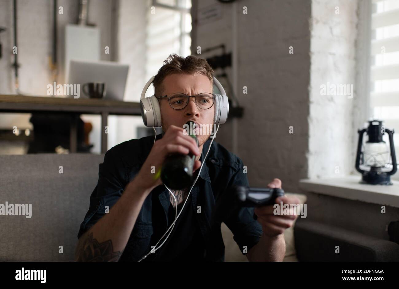 Drinking beer from bottle hi-res stock photography and images - Alamy