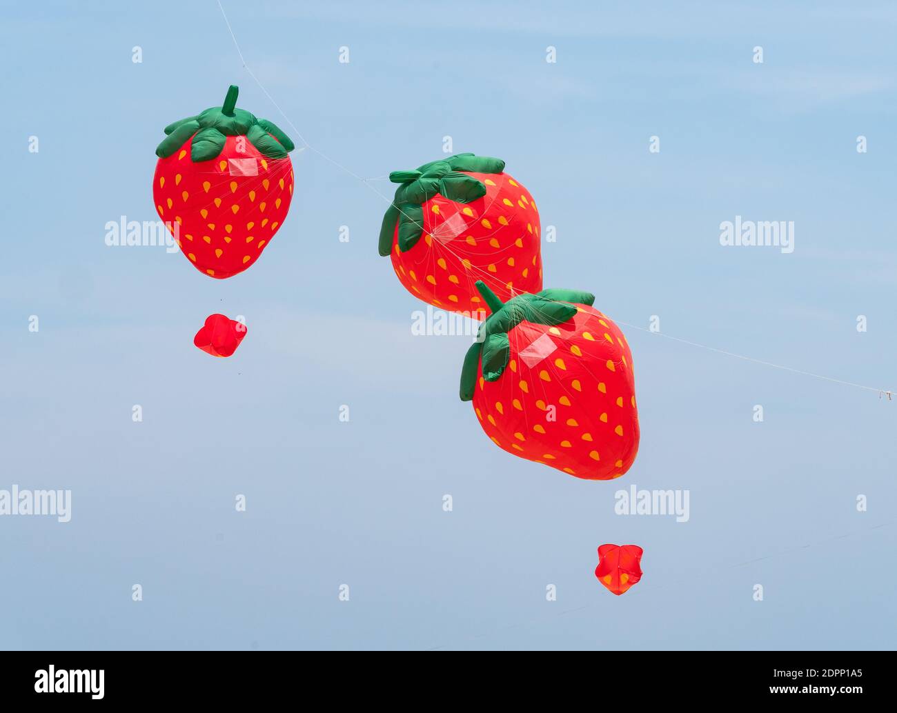 Strawberry kites, line laundry, on a blue sky background Stock Photo ...
