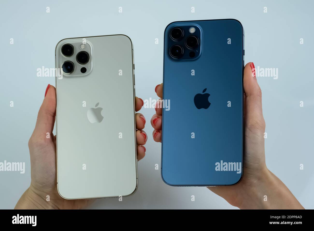 Iphone 12 Pro Max Pacific Blue Next To Iphone 12 Pro Max In Gold Stock 8780