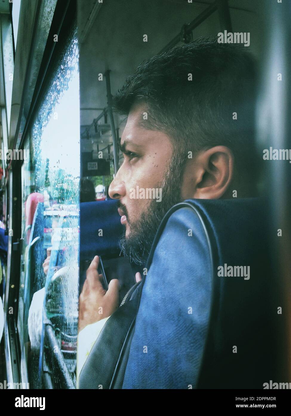 Man looking through bus window day hi-res stock photography and images ...